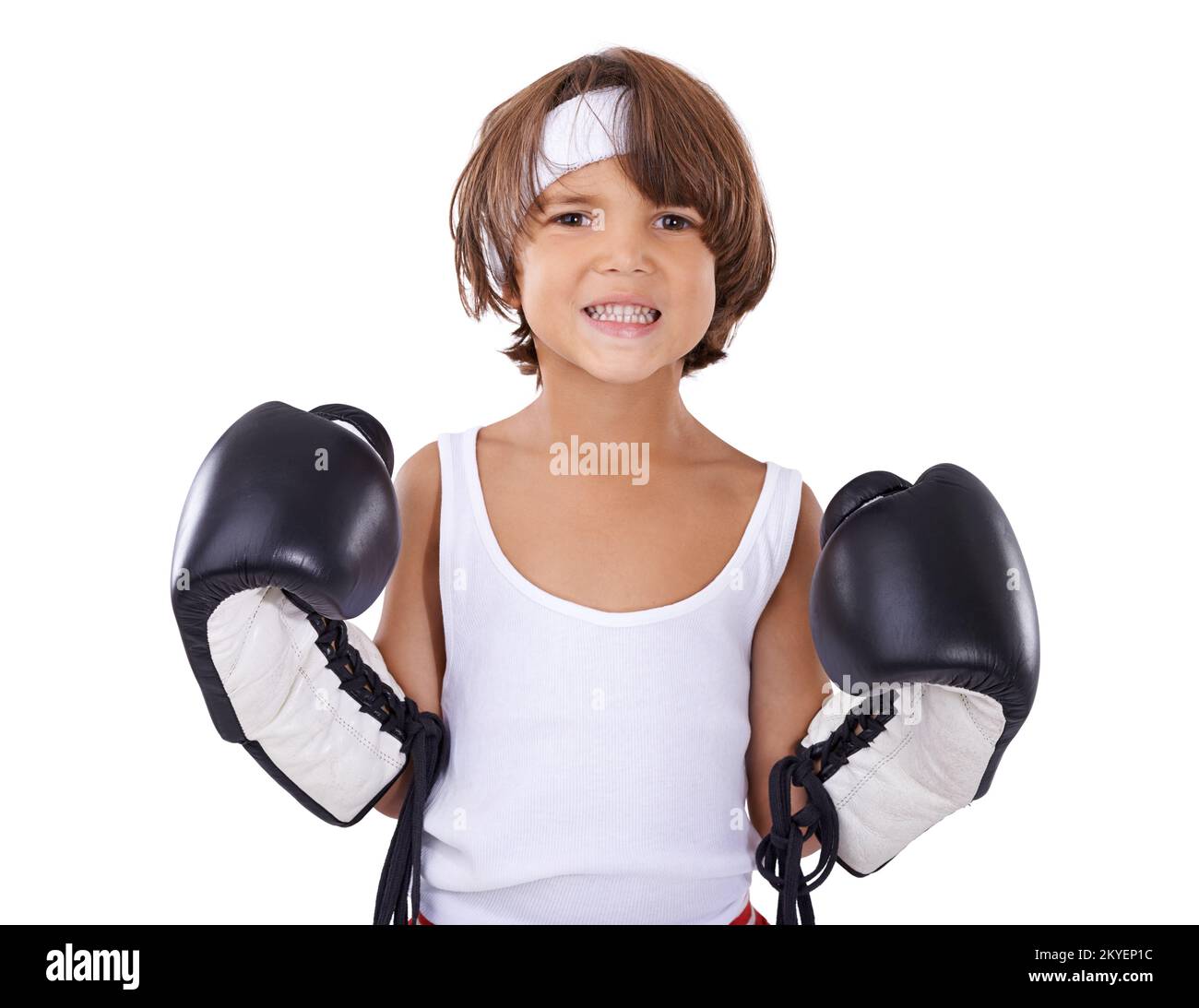 Hes an avid little boxer. Portrait of a young boy in boxing gear ...