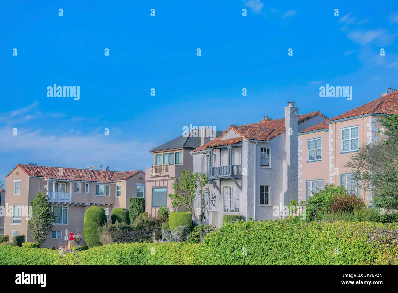 Multi-storey homes at a sunny neighborhood in San Francisco California ...