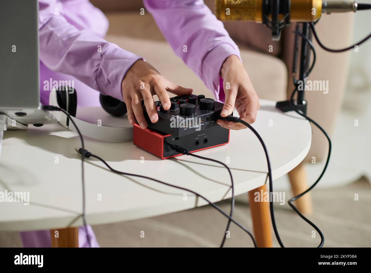 Closeup image of teenage girl setting mike and camera to record video ...