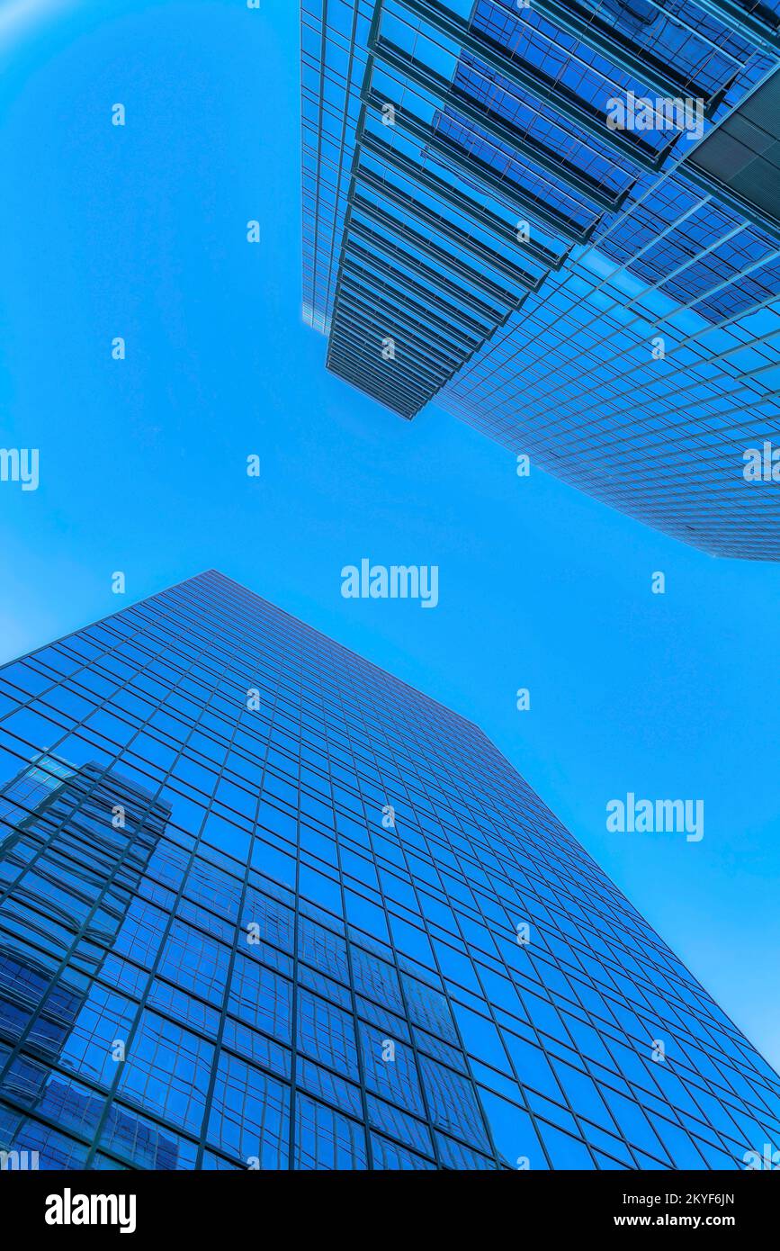 Looking up at business buildings in downtown Austin Texas against blue ...