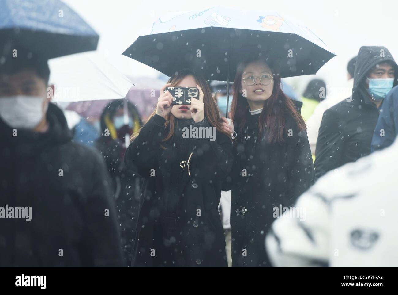 HANGZHOU, CHINA - DECEMBER 1, 2022 - Tourists view the snow on the ...