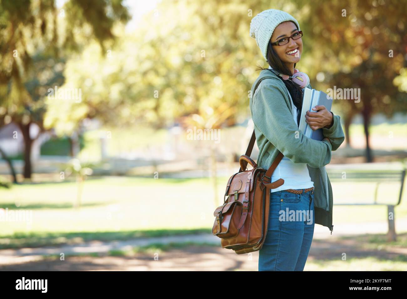 College style. a young college student carrying her school books Stock ...