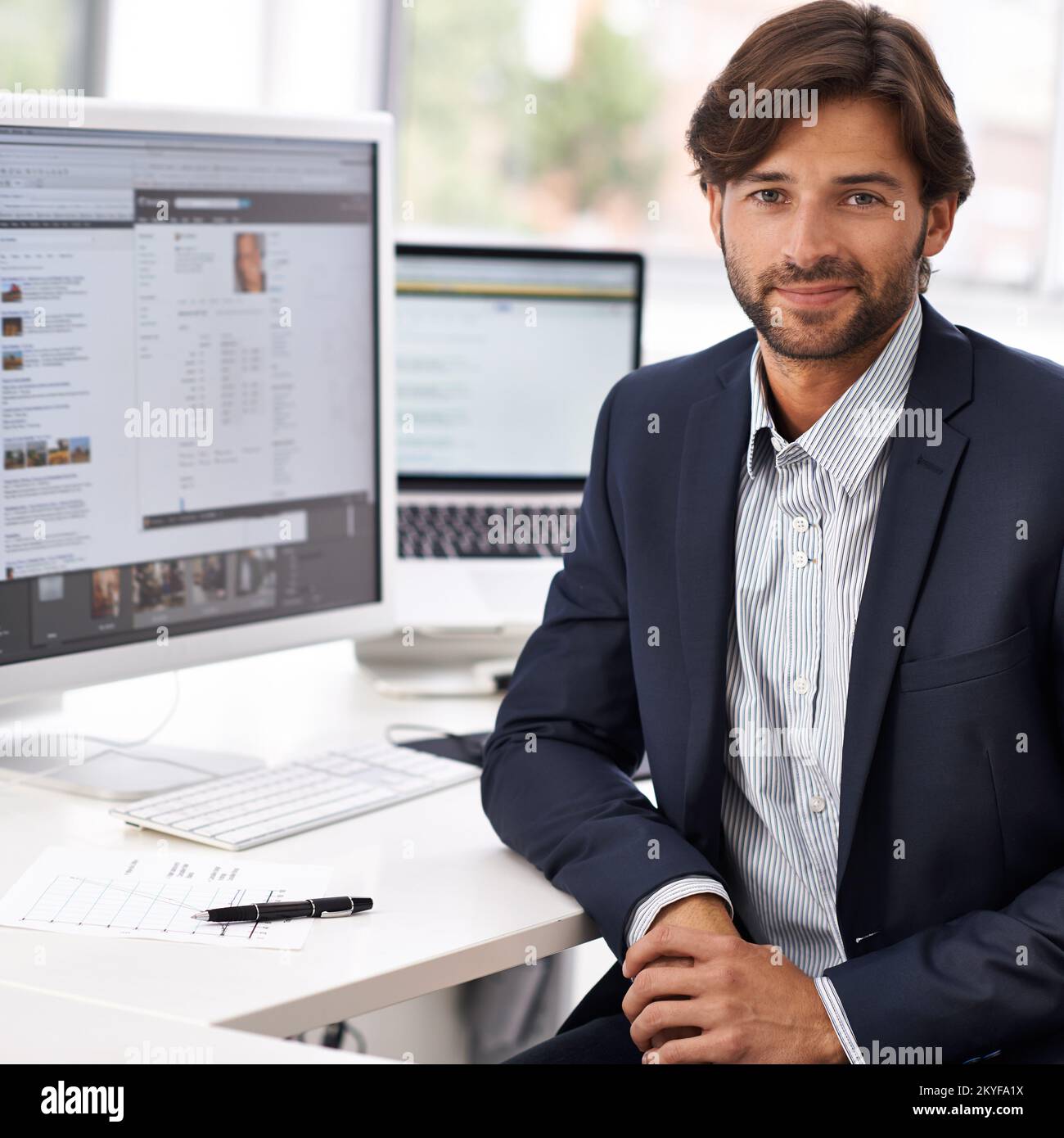 Handsome professional sitting desk working hi-res stock photography and ...