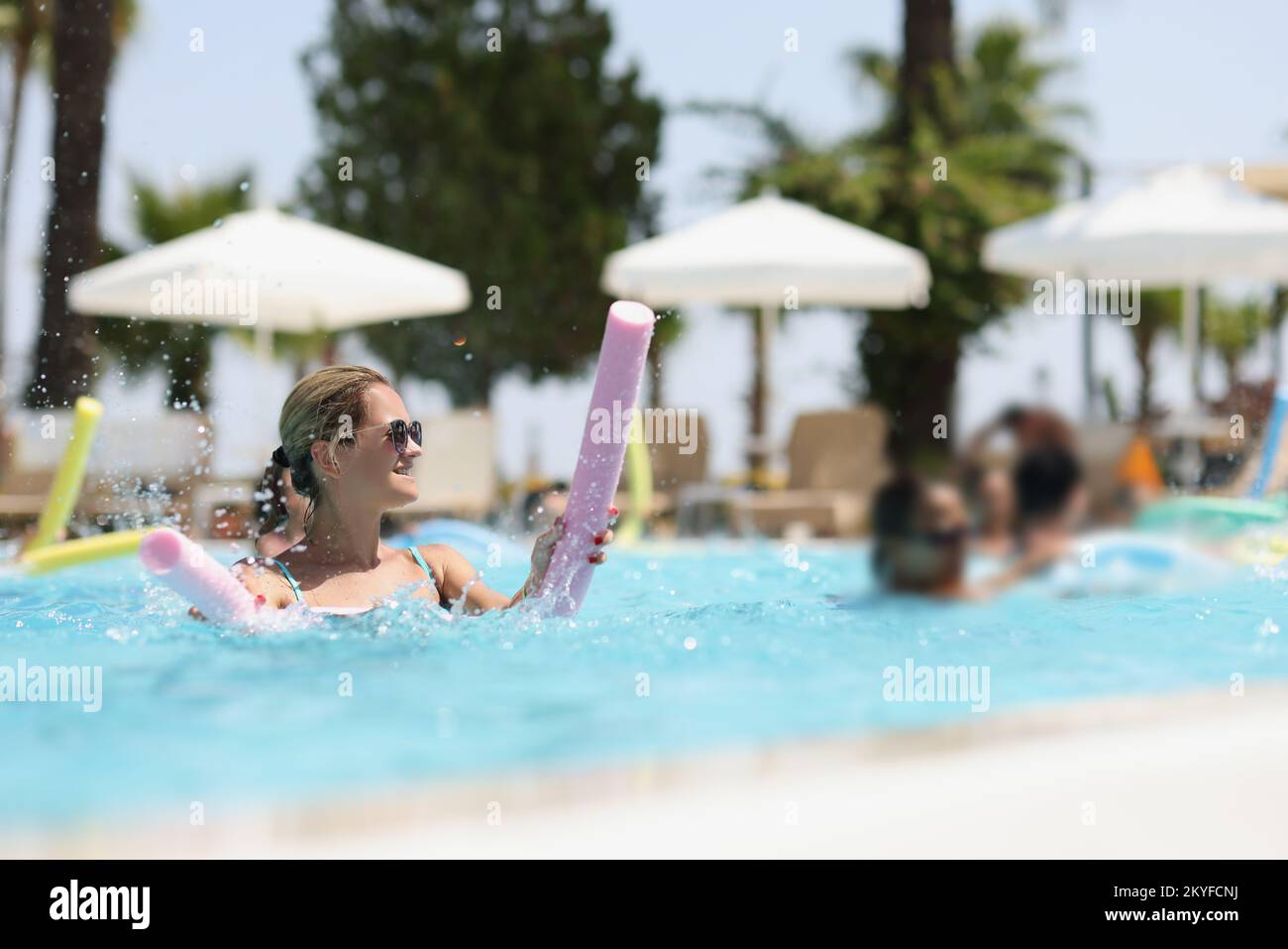 People are having fun in hotel pool Stock Photo - Alamy
