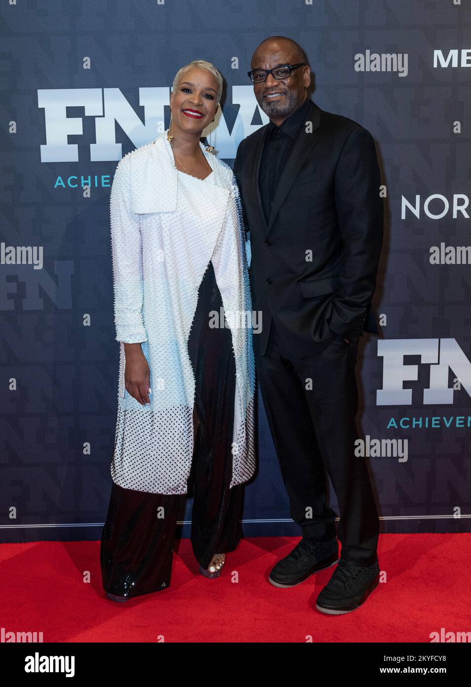 Brandice Daniel and Dr. D'Wayne Edwards attend the 2022 Footwear News ...