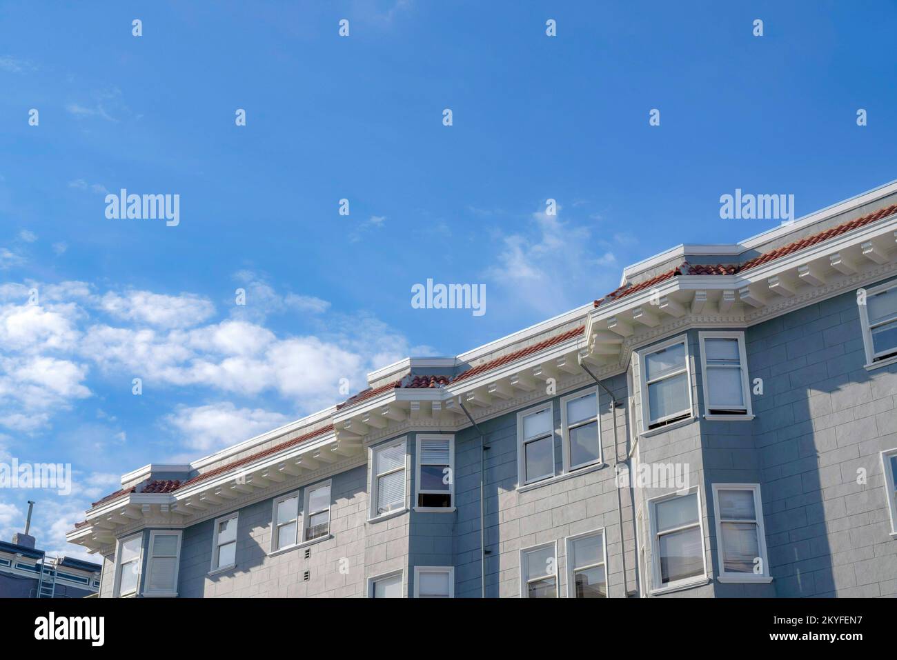 Apartment building with painted gray concrete tiles wall cladding in ...