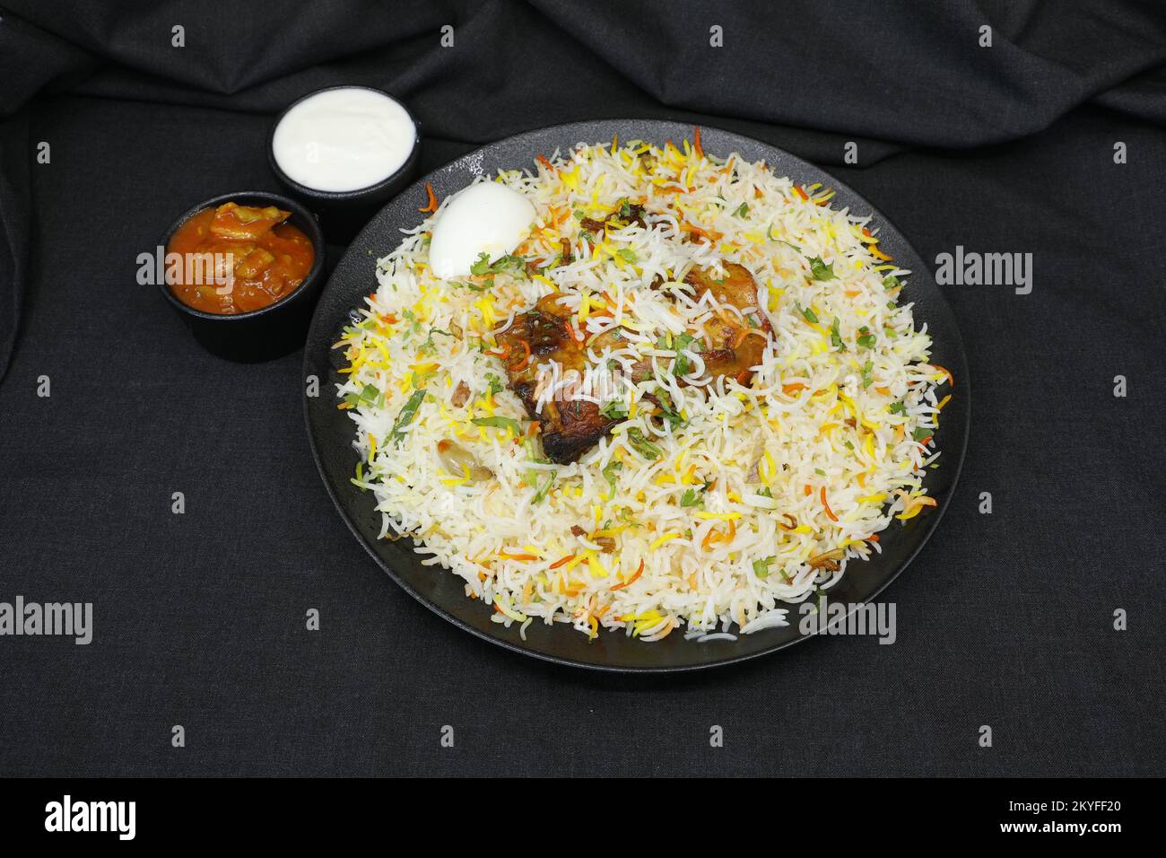Chicken Biriyani on black plate Stock Photo - Alamy