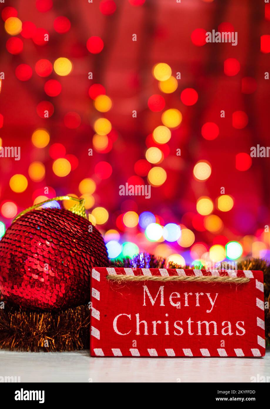 Merry Christmas wooden sign. Christmas composition on blurred lights ...