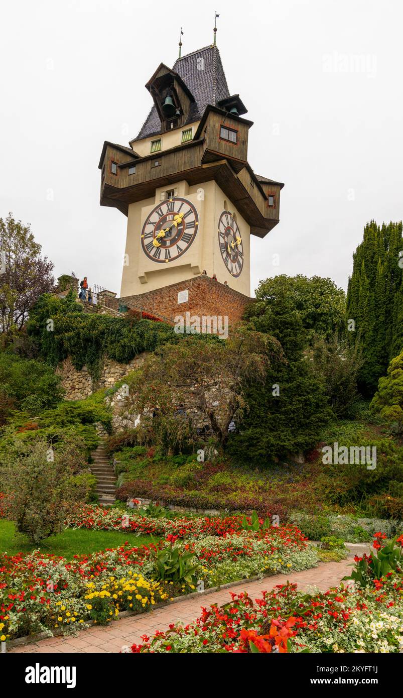 Graz, Austria - 9 October, 2022: view of the landmark medieval clock tower in downtown Graz ...