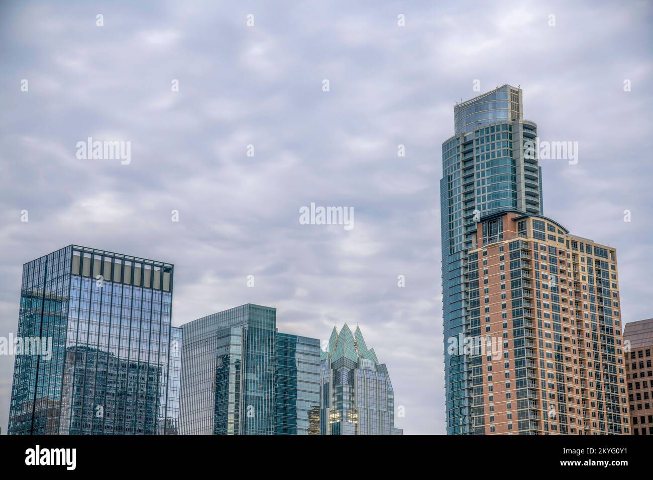 Skyline of downtown Austin Texas against sky covered with clouds ...