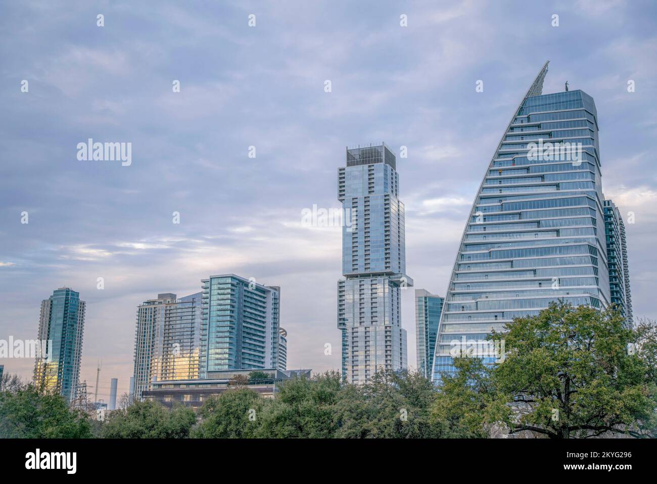 Buildings facade featuring modern architecture behind lush green ...