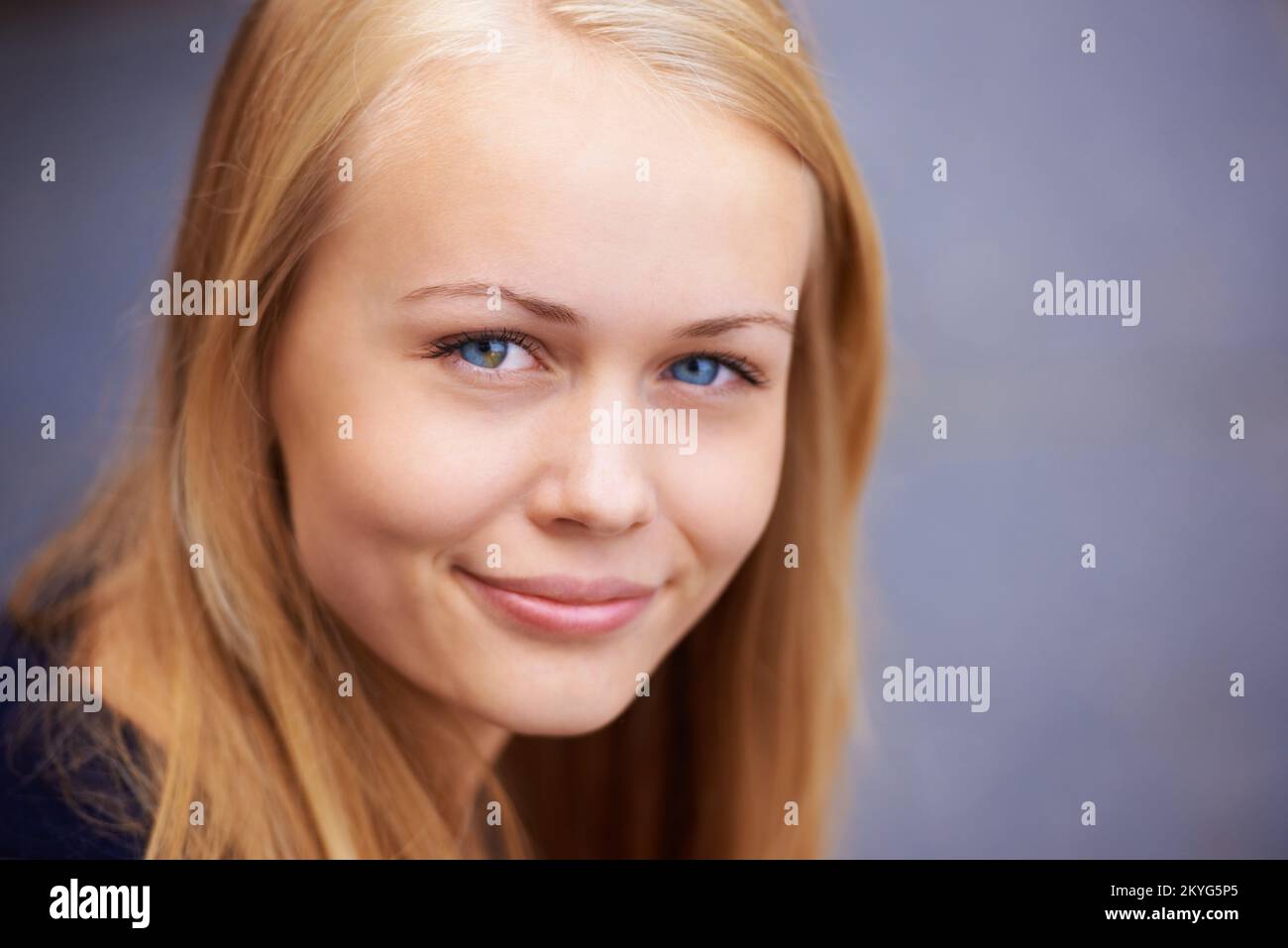Content and beautiful. Portrait of an attractive young woman smiling ...