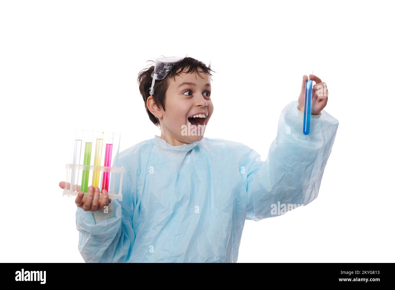 Smart nerd teenager in lab coat, holding test tube with chemicals and ...