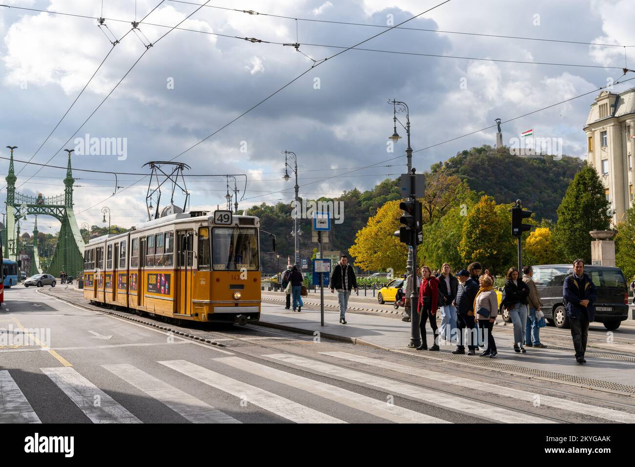 Budapest, Hungary - 4 October, 2022: yellow Budapest tram arrives at ... Budapest, Hungary - 4 October, 2022: yellow Budapest tram arrives at ...