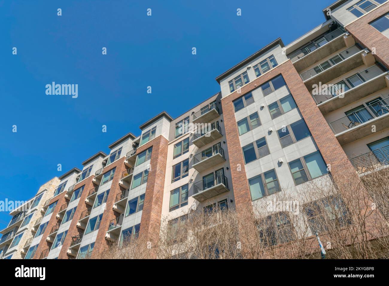 Austin, Texas- Low angle view of a mid-rise apartment building. Facade ...