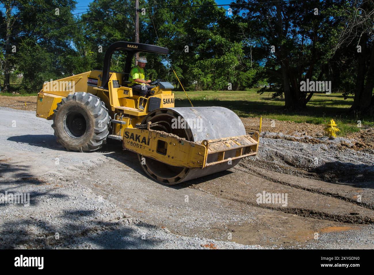 Biloxi, MS, May 6, 2015 - Using a heavy equipment compactor, a ...