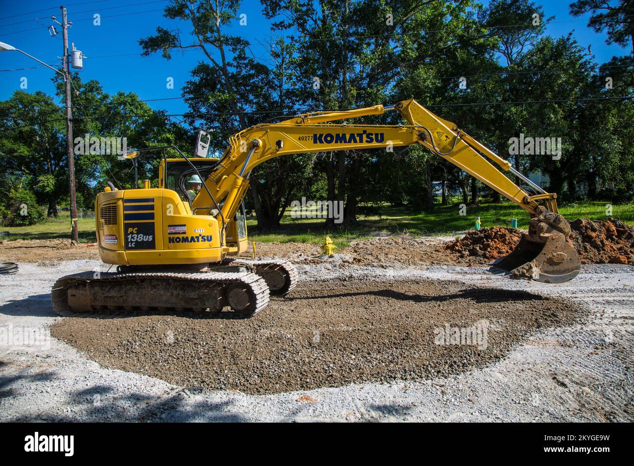 Biloxi, MS, May 6, 2015 - Using a heavy equipment excavator, a ...