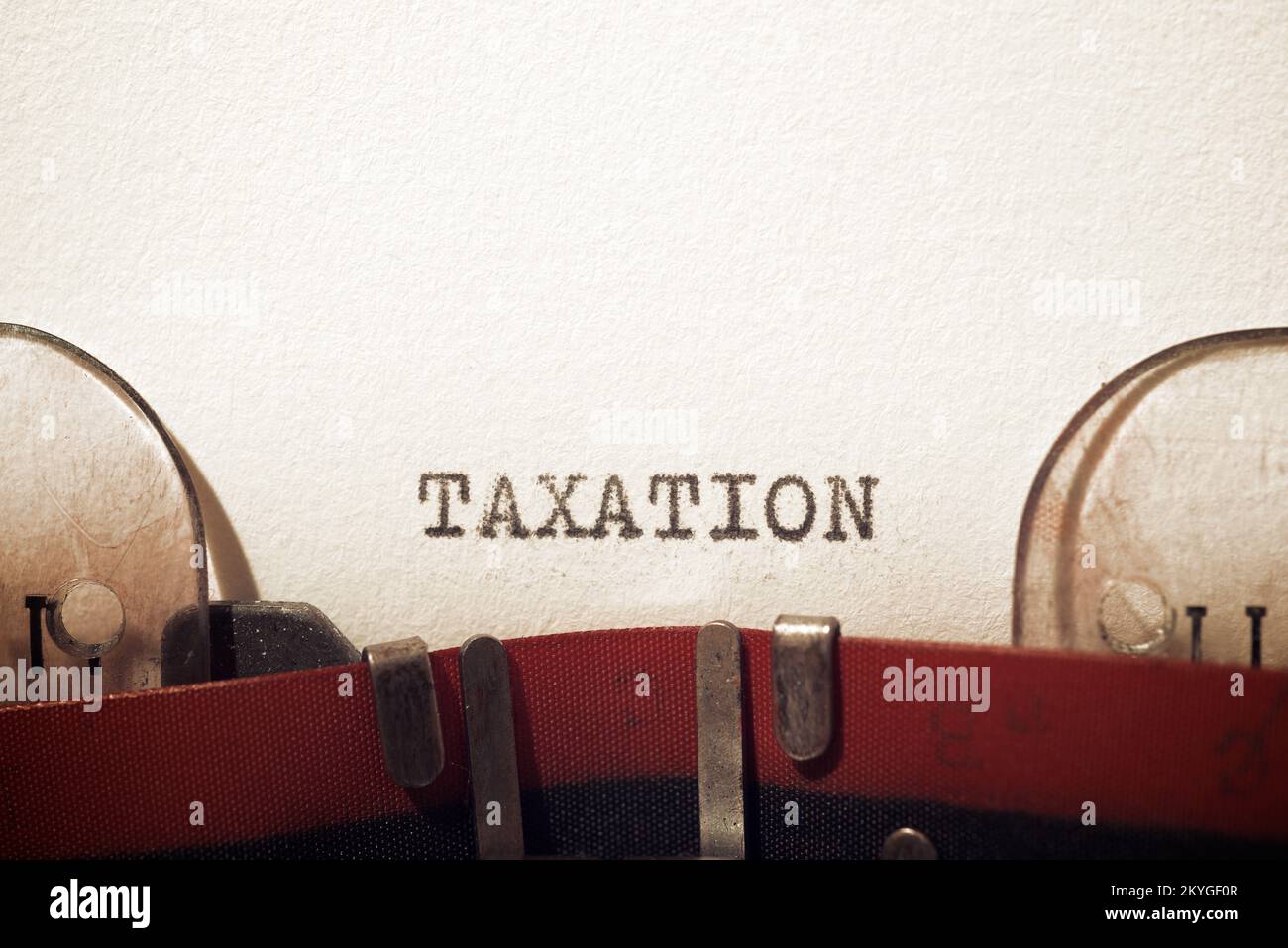 Taxation text written with a typewriter Stock Photo - Alamy