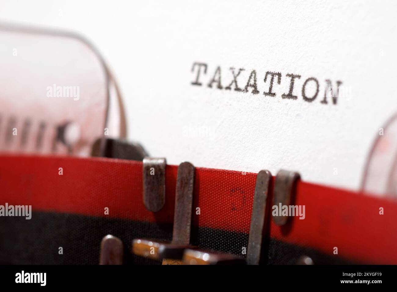 Taxation text written with a typewriter Stock Photo - Alamy