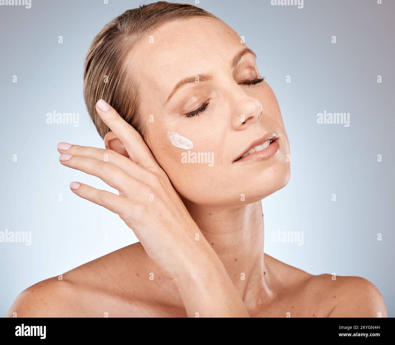 Woman face in sun cream hi-res stock photography and images - Alamy