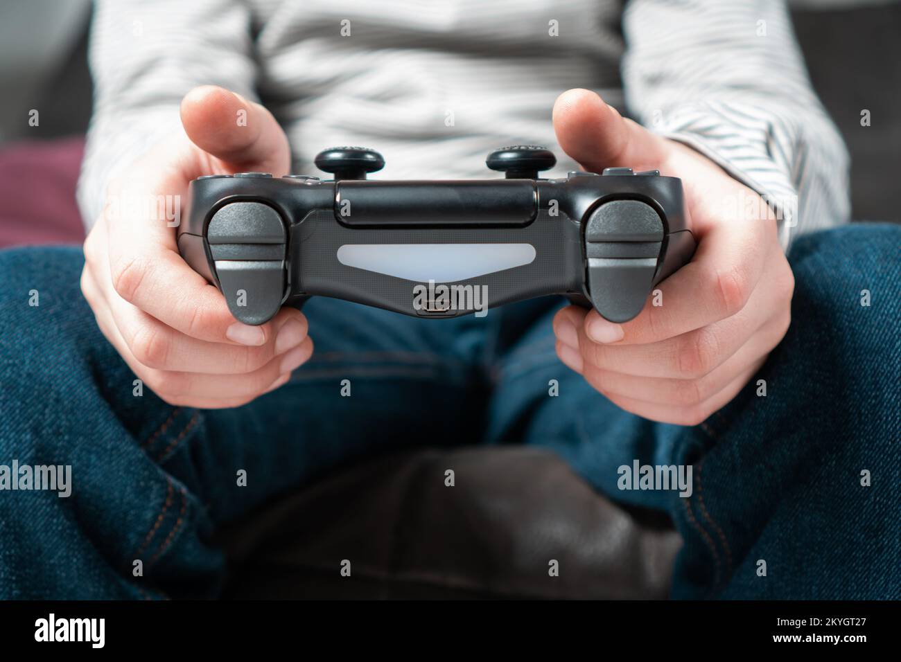 Male hands hold modified plastic joystick closeup, selective focus ...