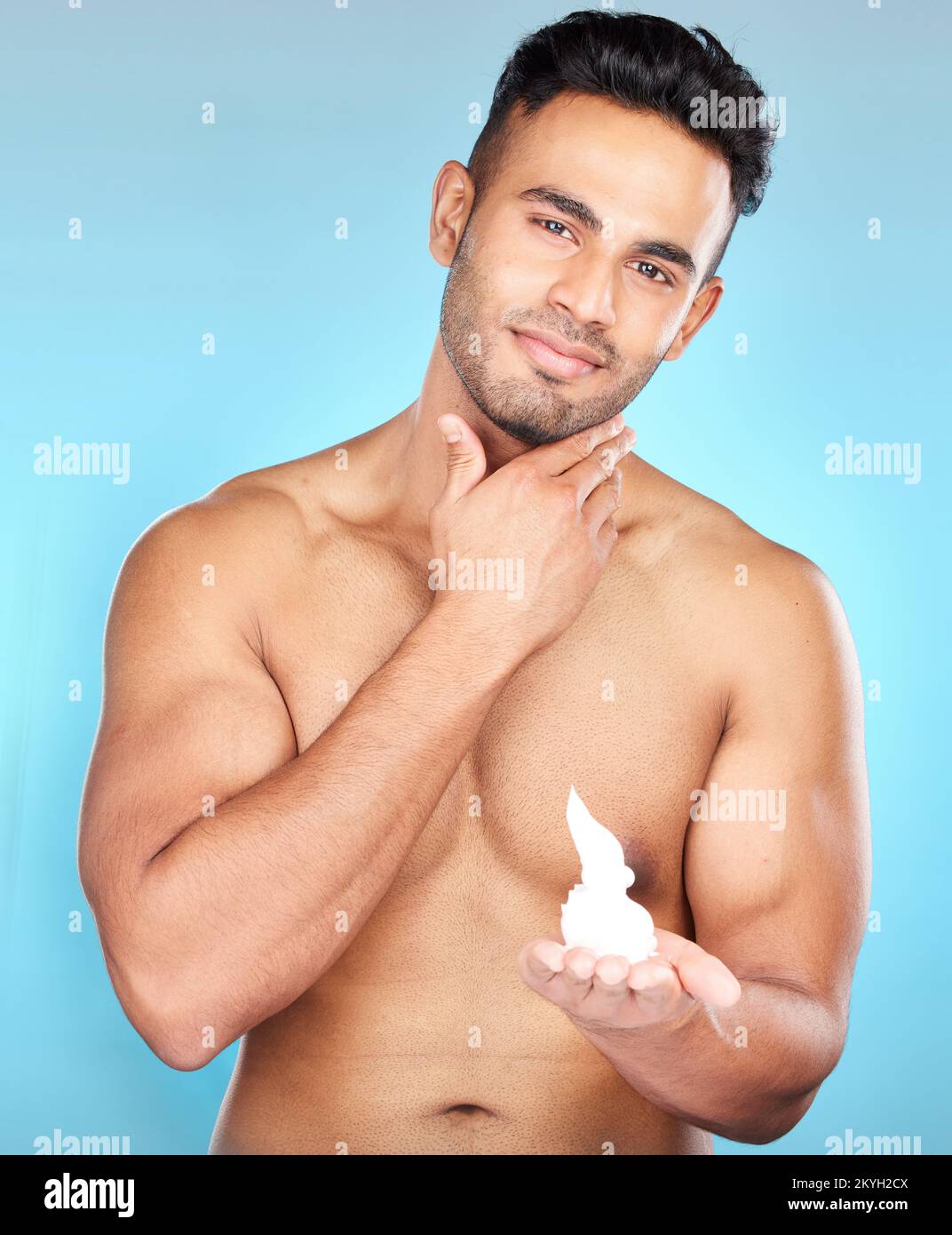 Foam, shave and man portrait with cream for epilation, beauty and skincare or haircare on a blue ...