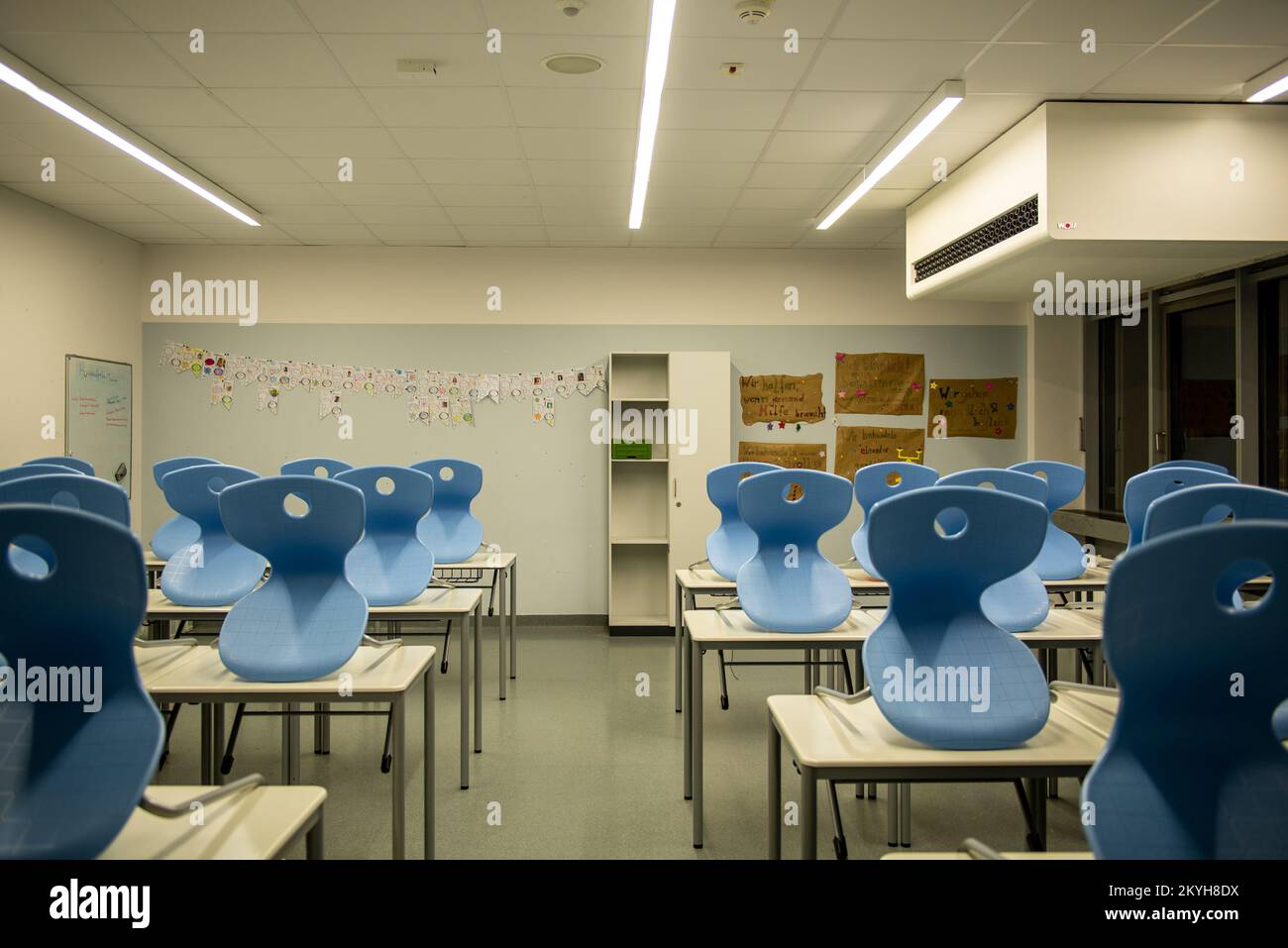 View of an empty classroom in a german school with motivational phrases ...