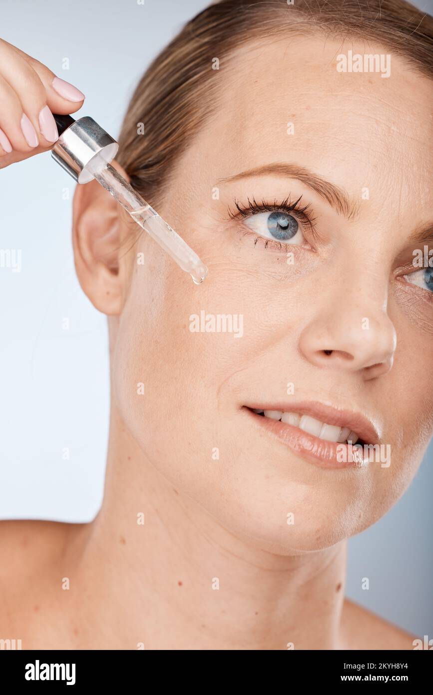 Skincare, beauty and woman with serum on face for anti aging and ...