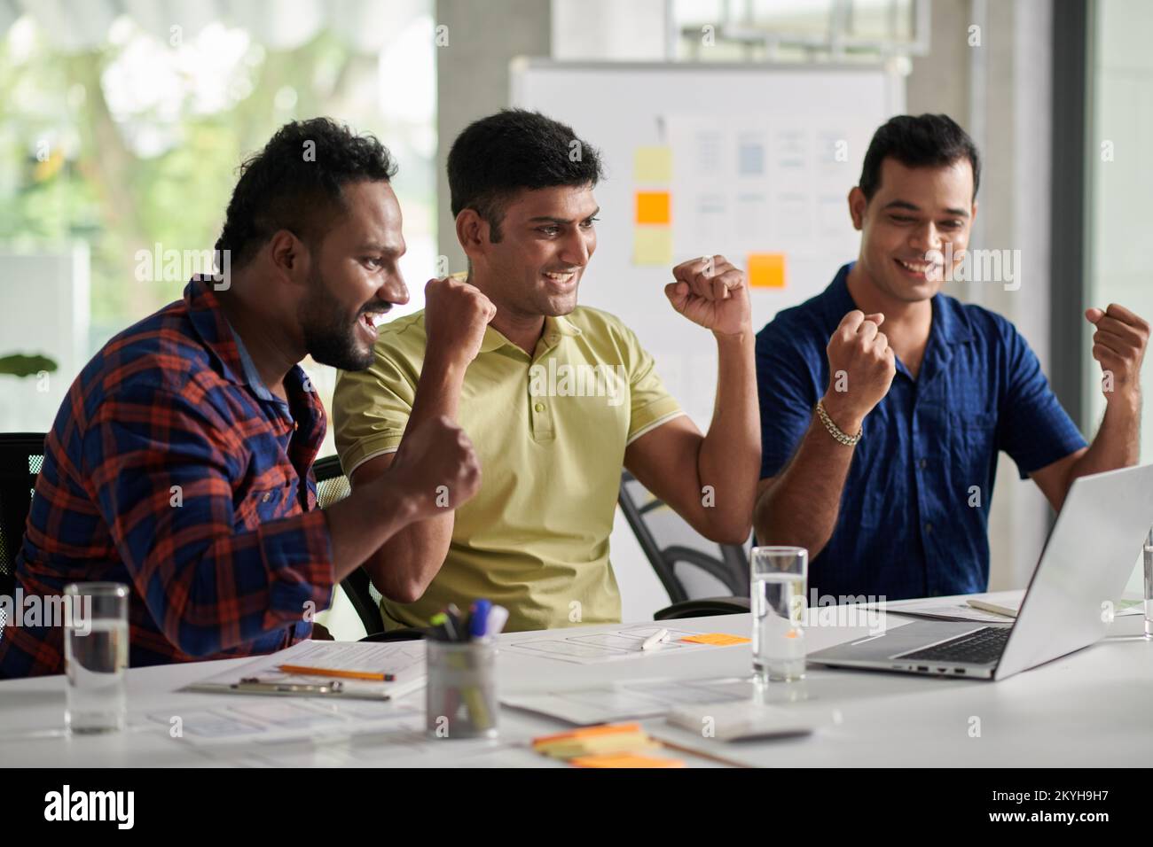 Joyful UX designers celebrating after receiving good feedback on their ...