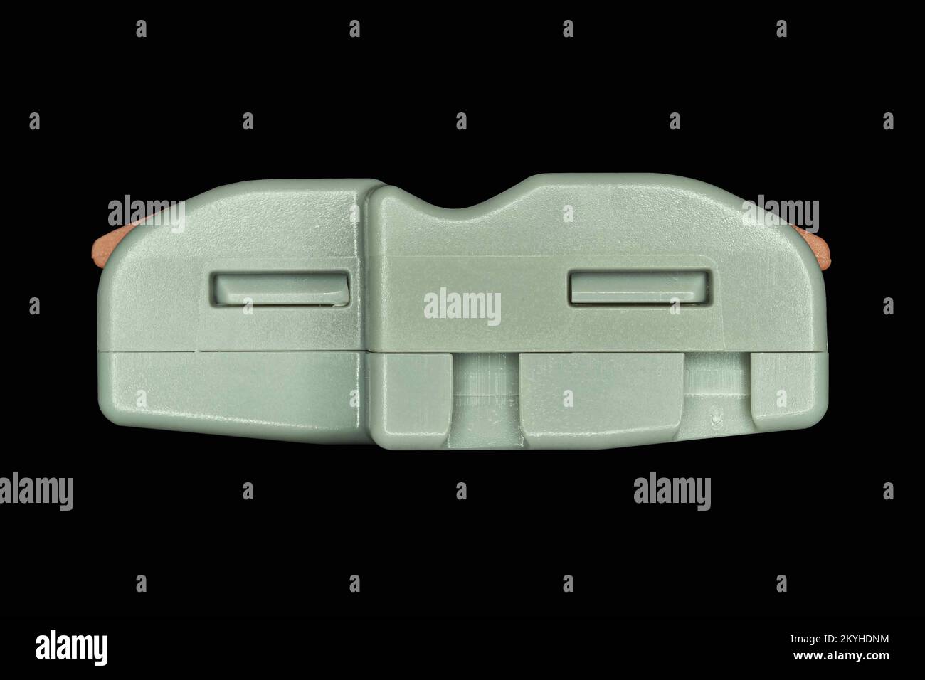 Compact splicing connector isolated on black background. Close-up. A ...
