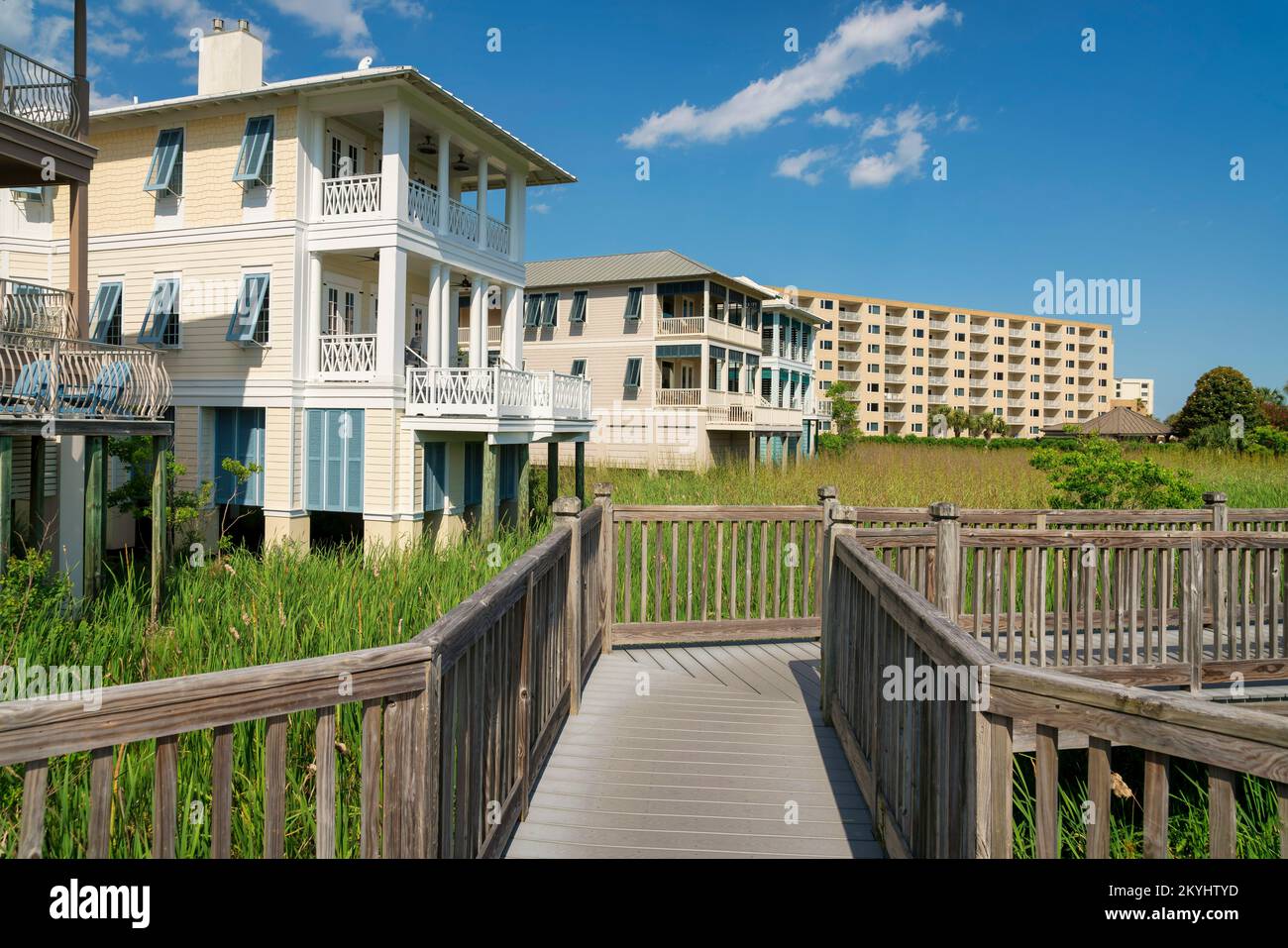 Destin, Florida- Boardwalk with a view of elevated residential ...