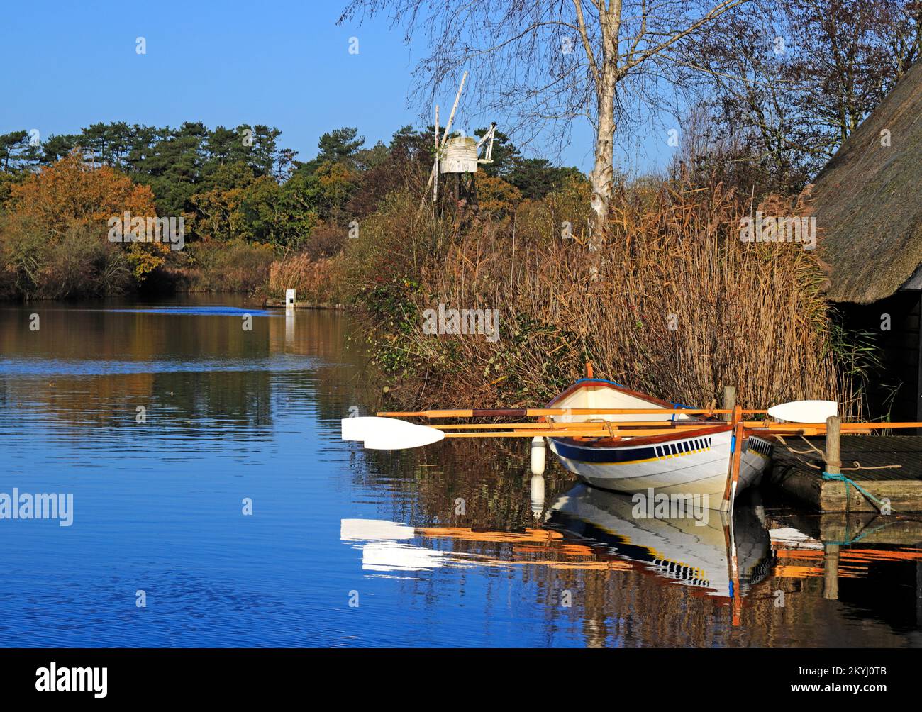 A view of the River Ant on the Norfolk Broads in autumn with moored ...
