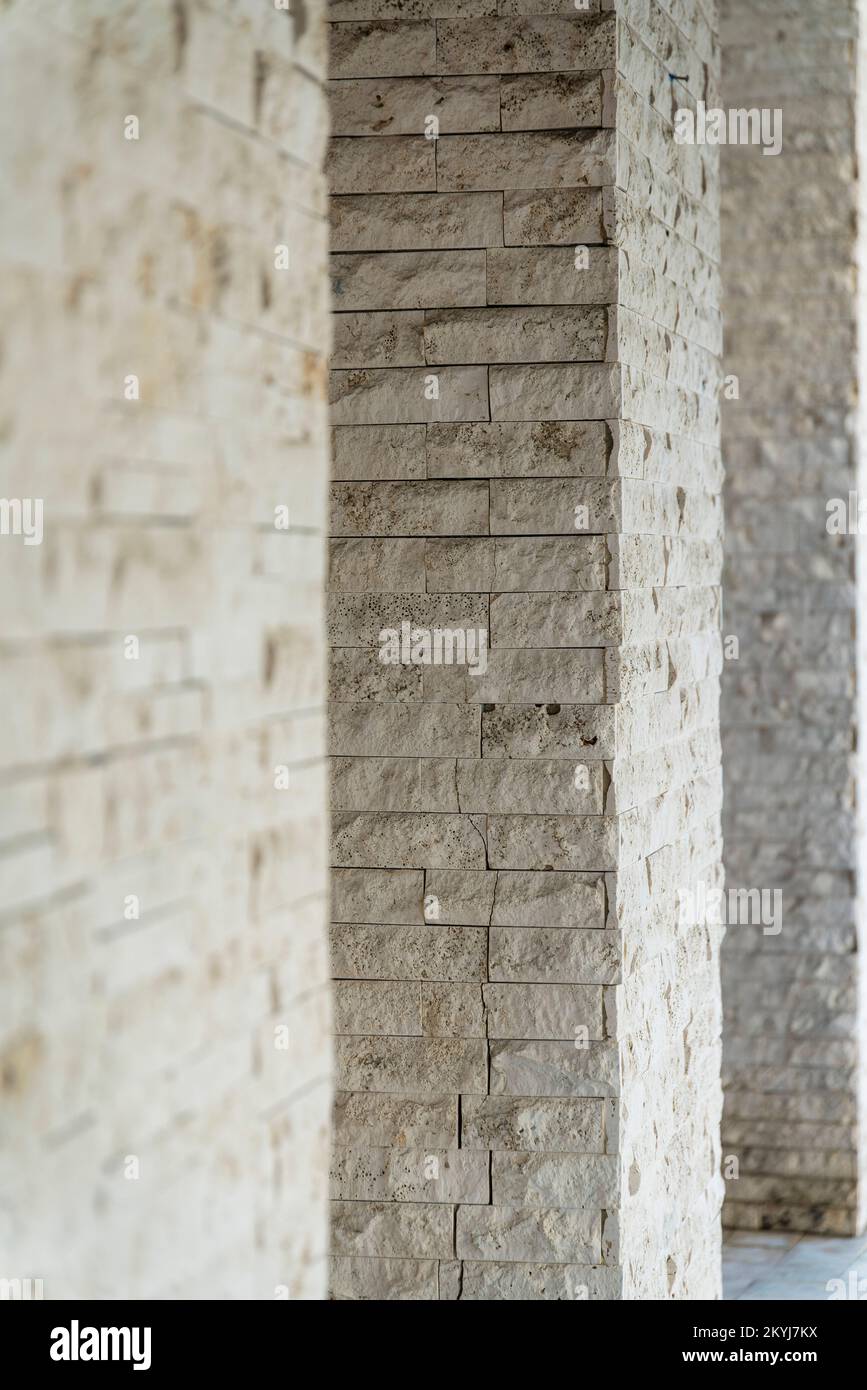 Pillar marble bricks walls in a row at Miami, Florida. Selective focus ...