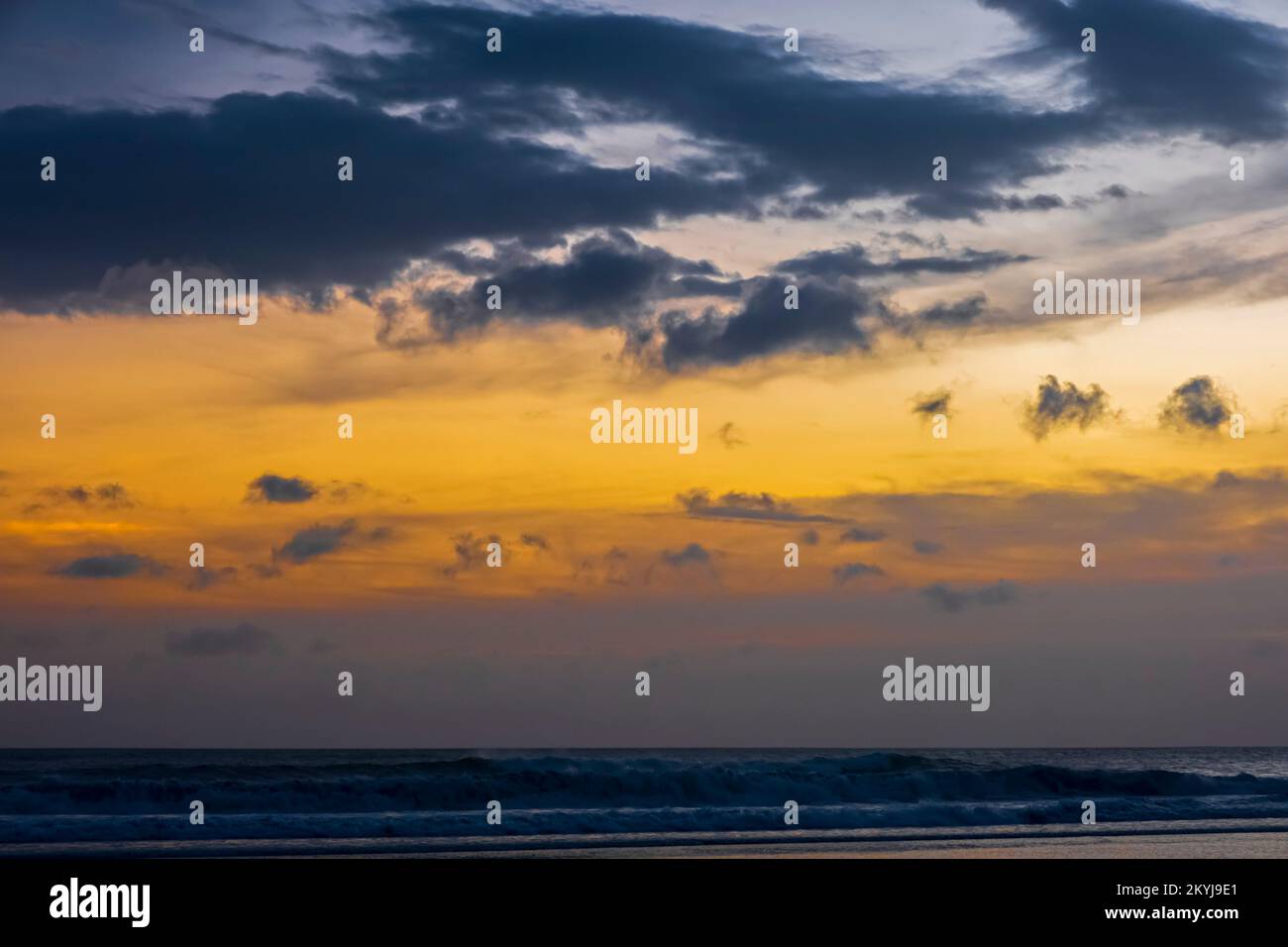 Calm sea with sunset sky and sun through the clouds over. Meditation ...