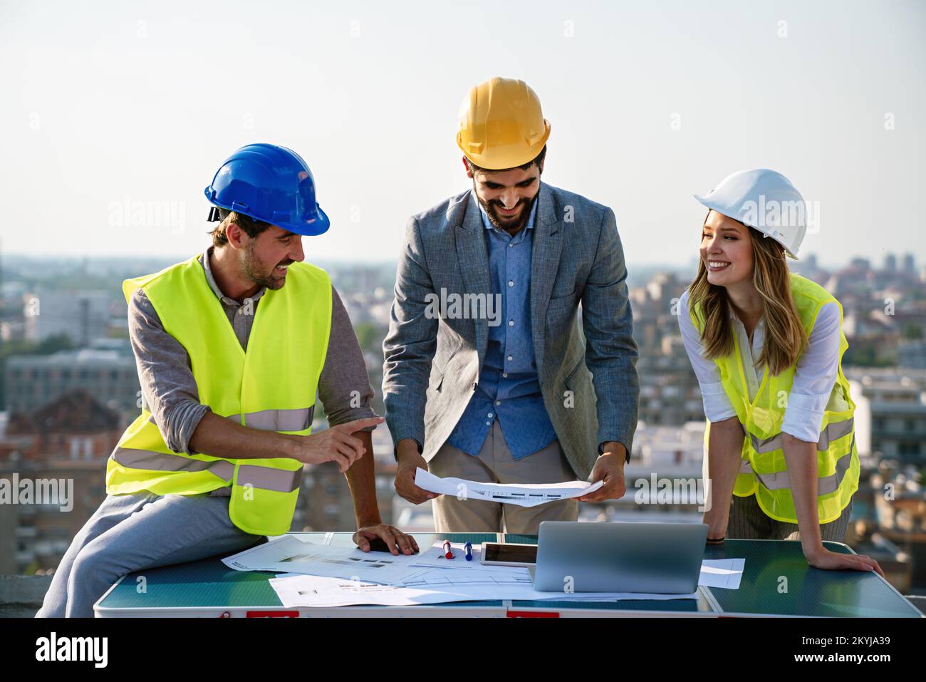 Construction concept. Engineers and architects working at construction ...