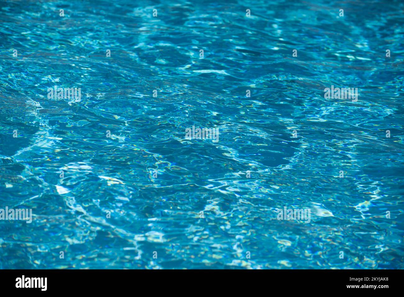 Abstract ripple wave and clear turquoise water surface in swimming pool ...