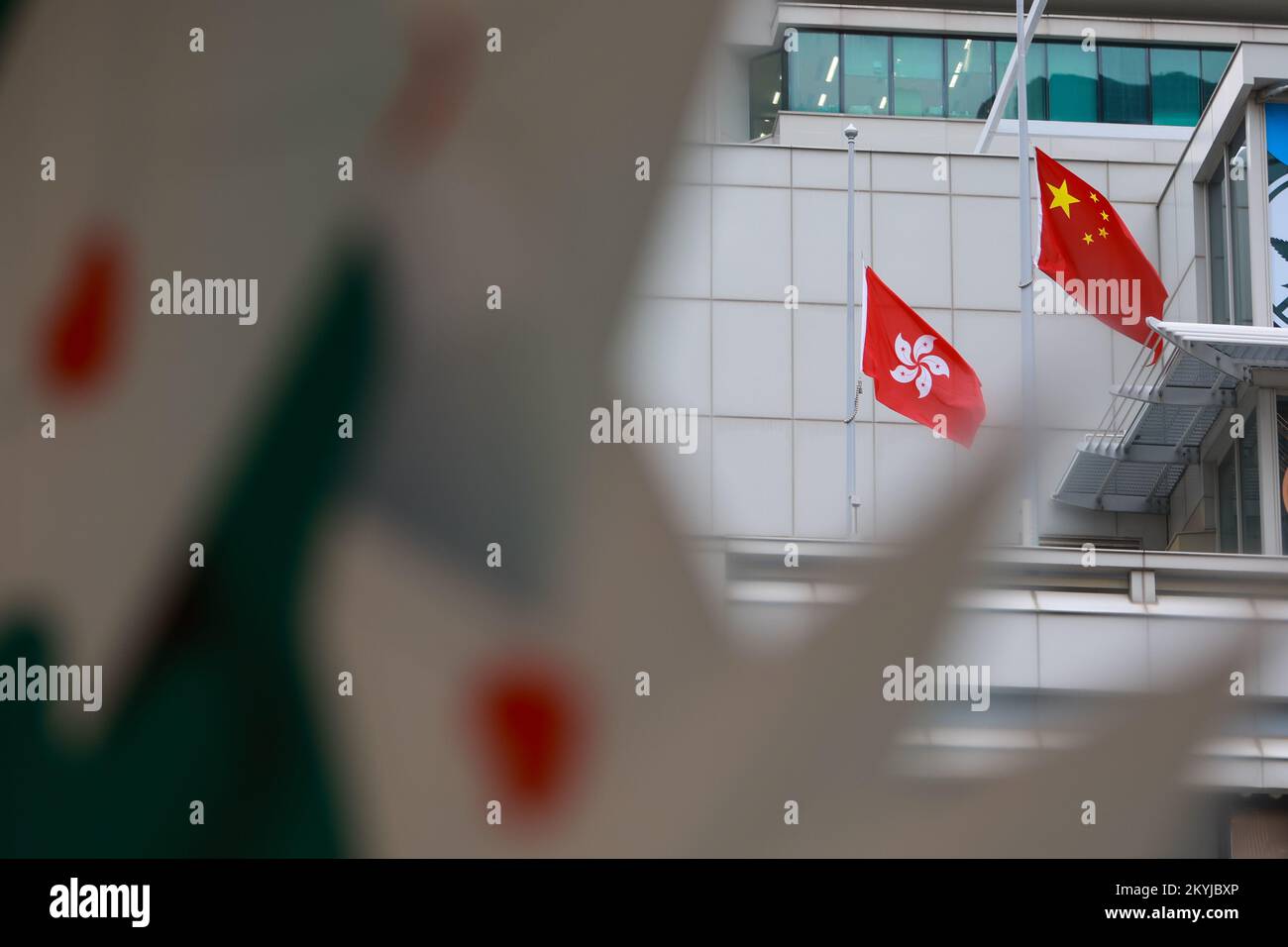 Hong Kong, Hong Kong, China. 1st Dec, 2022. Hong Kong SAR flag (Left ...