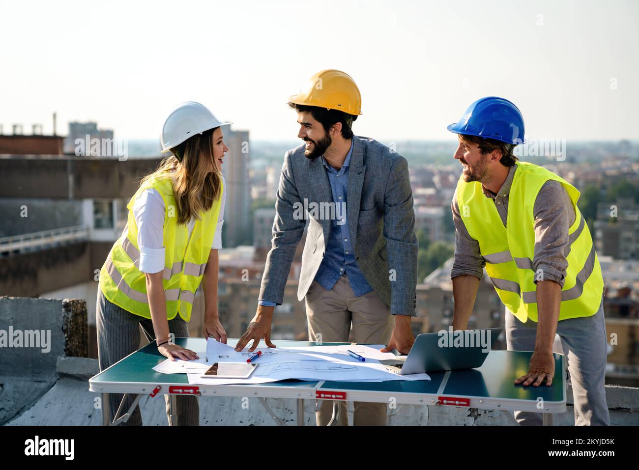 Construction concept. Engineers and architects working at construction ...