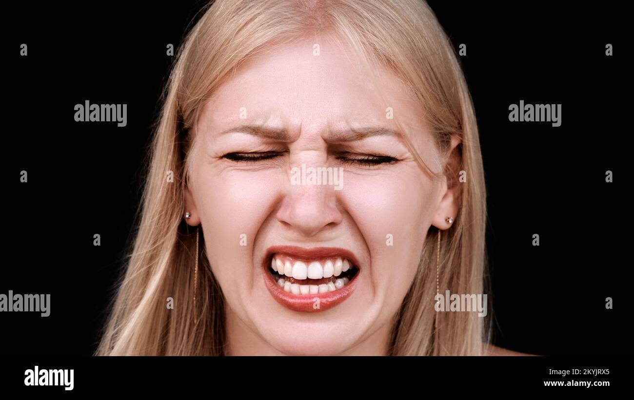 Headshot of young crying woman experiencing grief or loss. Grimace of ...
