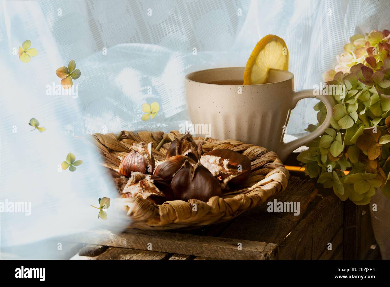 Baked chestnuts with tea in the autumn windy day Stock Photo - Alamy
