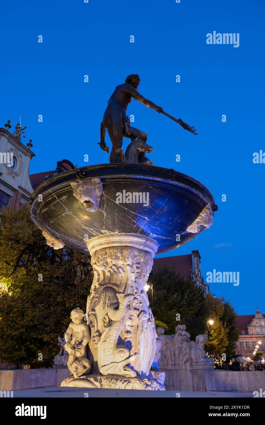 The Neptune Fountain at night in city of Gdansk, Poland. Bronze ...
