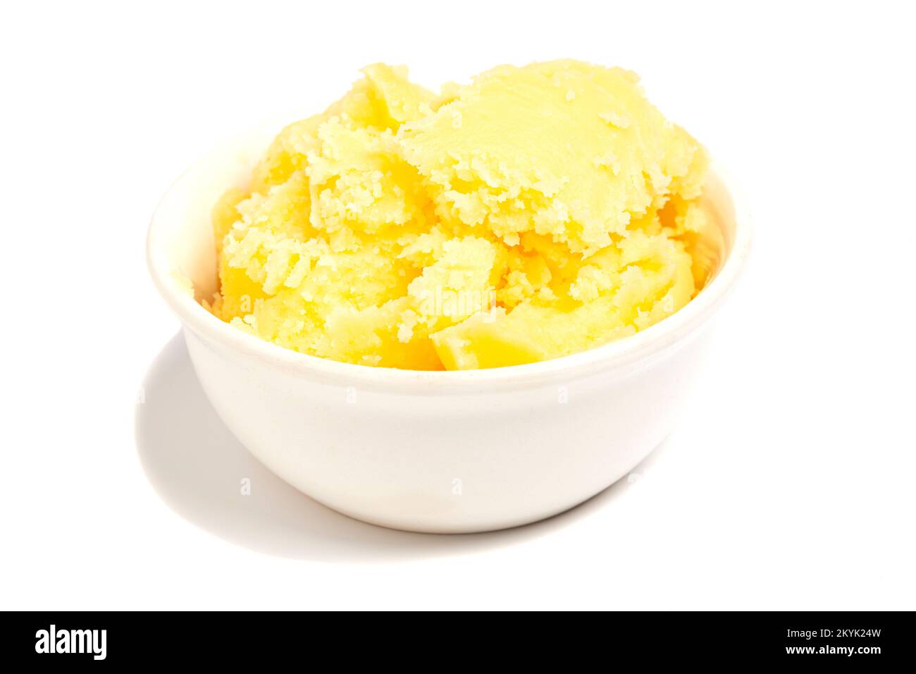 Ghee in bowl isolated on white background Stock Photo - Alamy