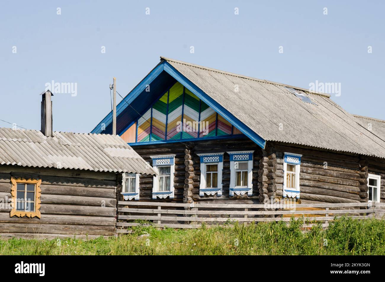 Country house with an unusual pattern on the pediment. colored waves ...