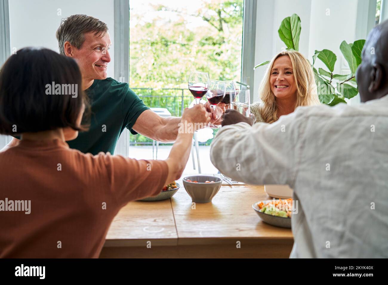 Three people making a toast hi-res stock photography and images - Alamy