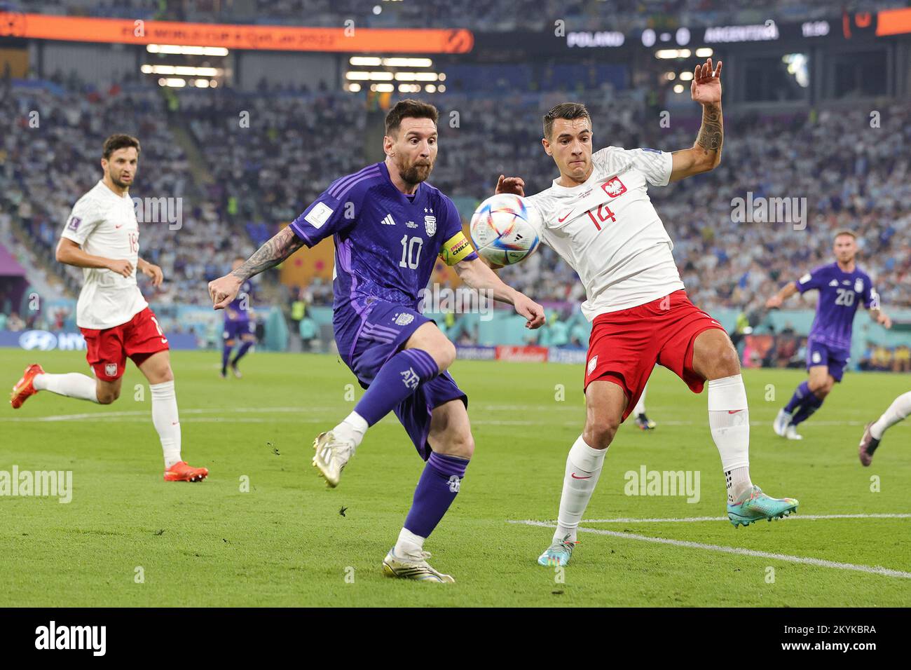 Lionel Messi of Argentina and Jakub Kiwior of Poland during the FIFA ...