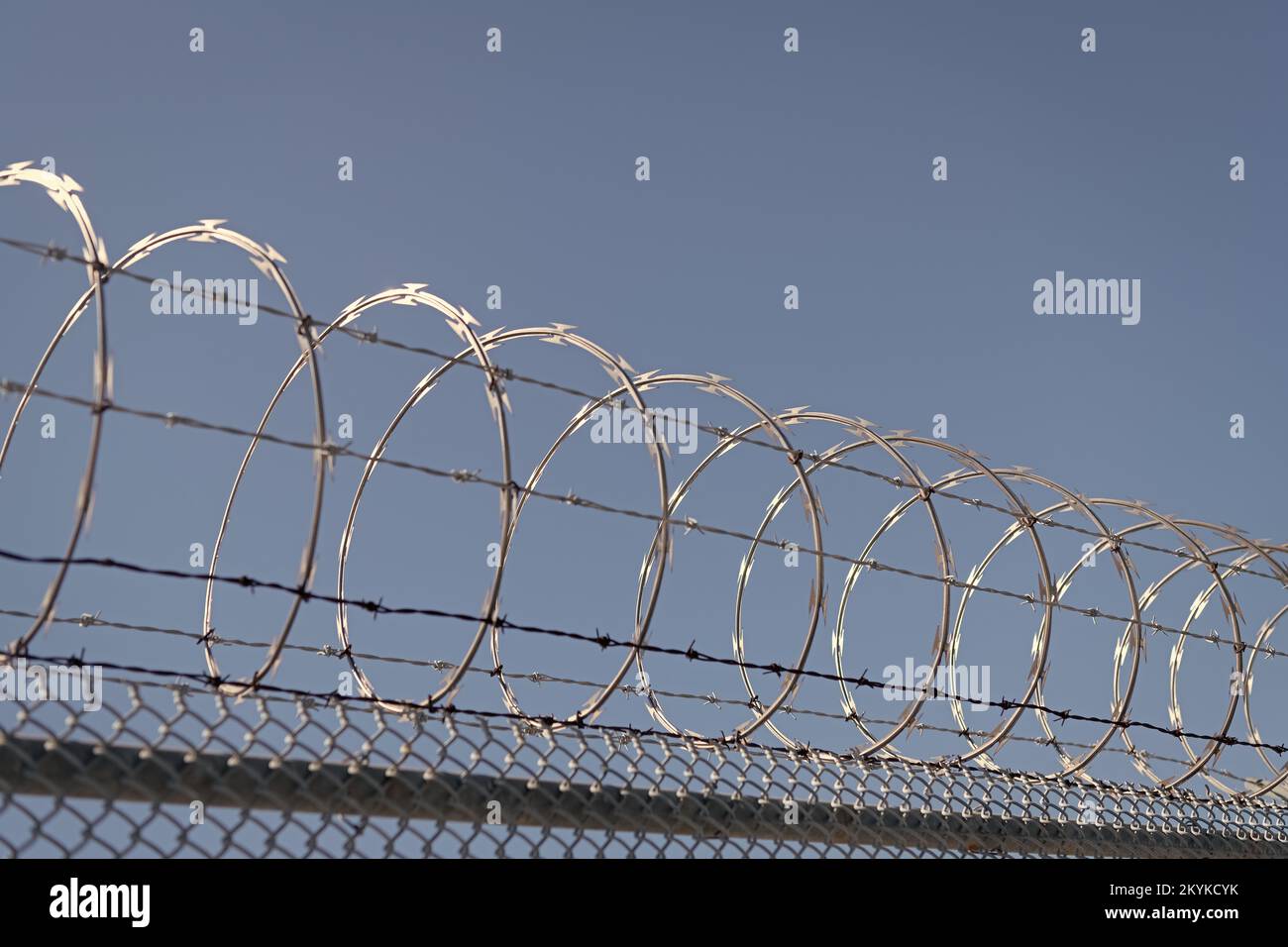 jail wall. highly protected prison wall with barbed wire fence. steel ...