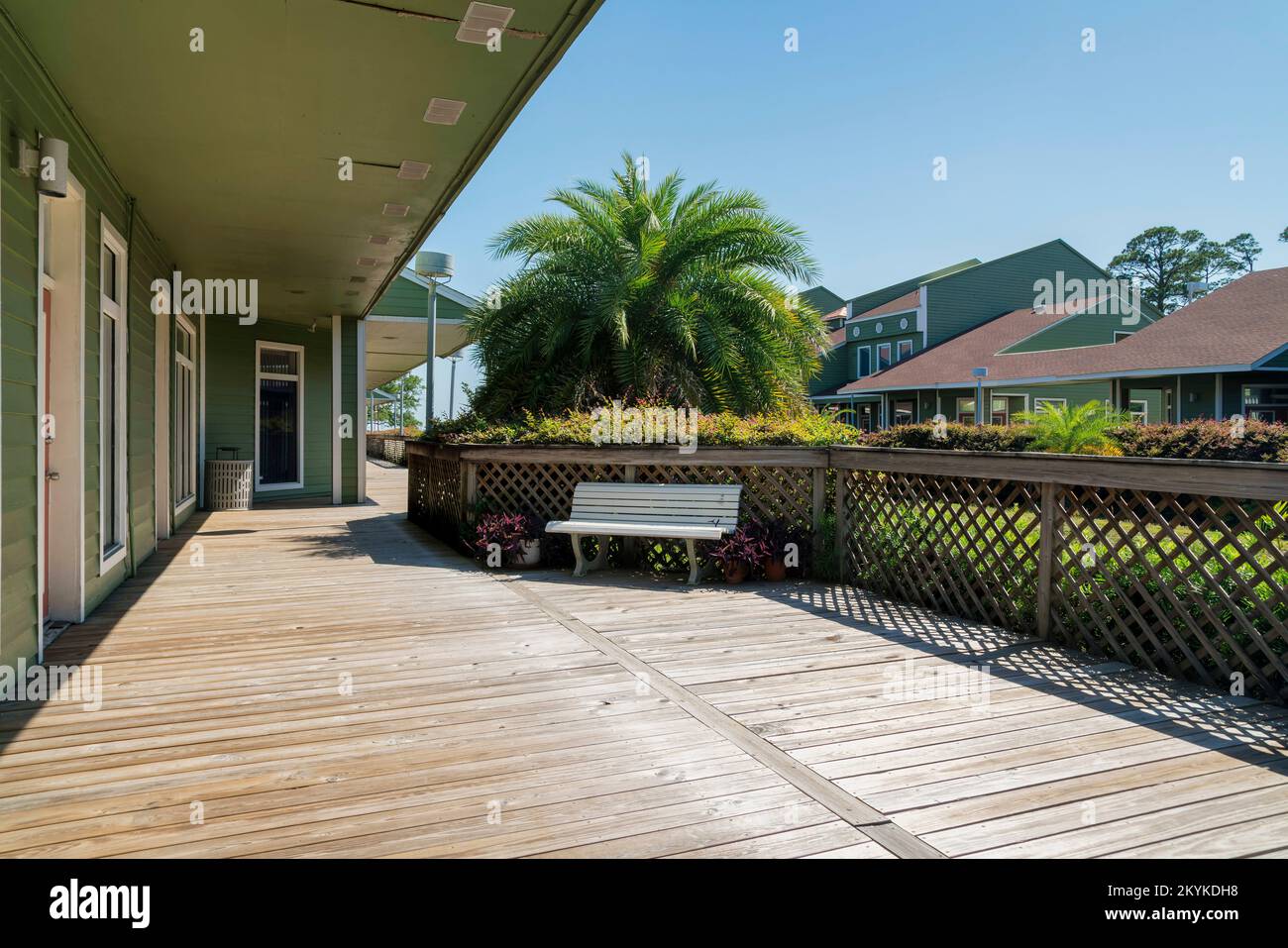 Destin, Florida- Boardwalk with white bench near the wood railings near ...