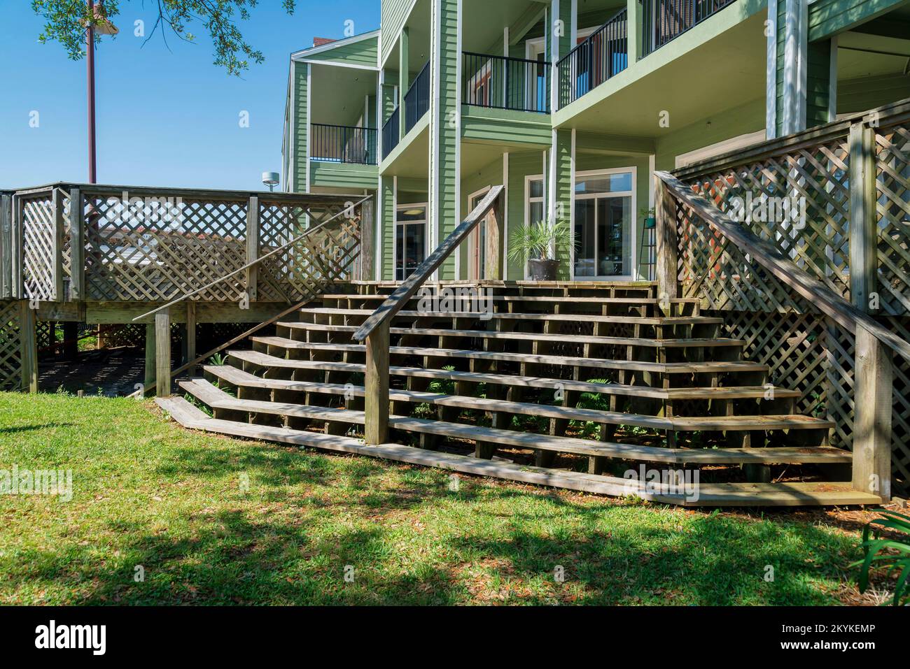 Navarre, Florida- Wide wooden staircase with handrails in the middle ...
