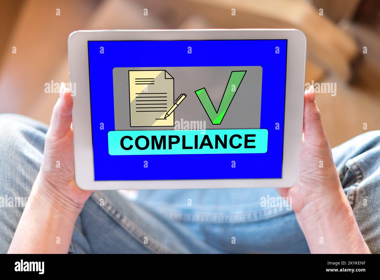 Tablet screen displaying a compliance concept Stock Photo - Alamy