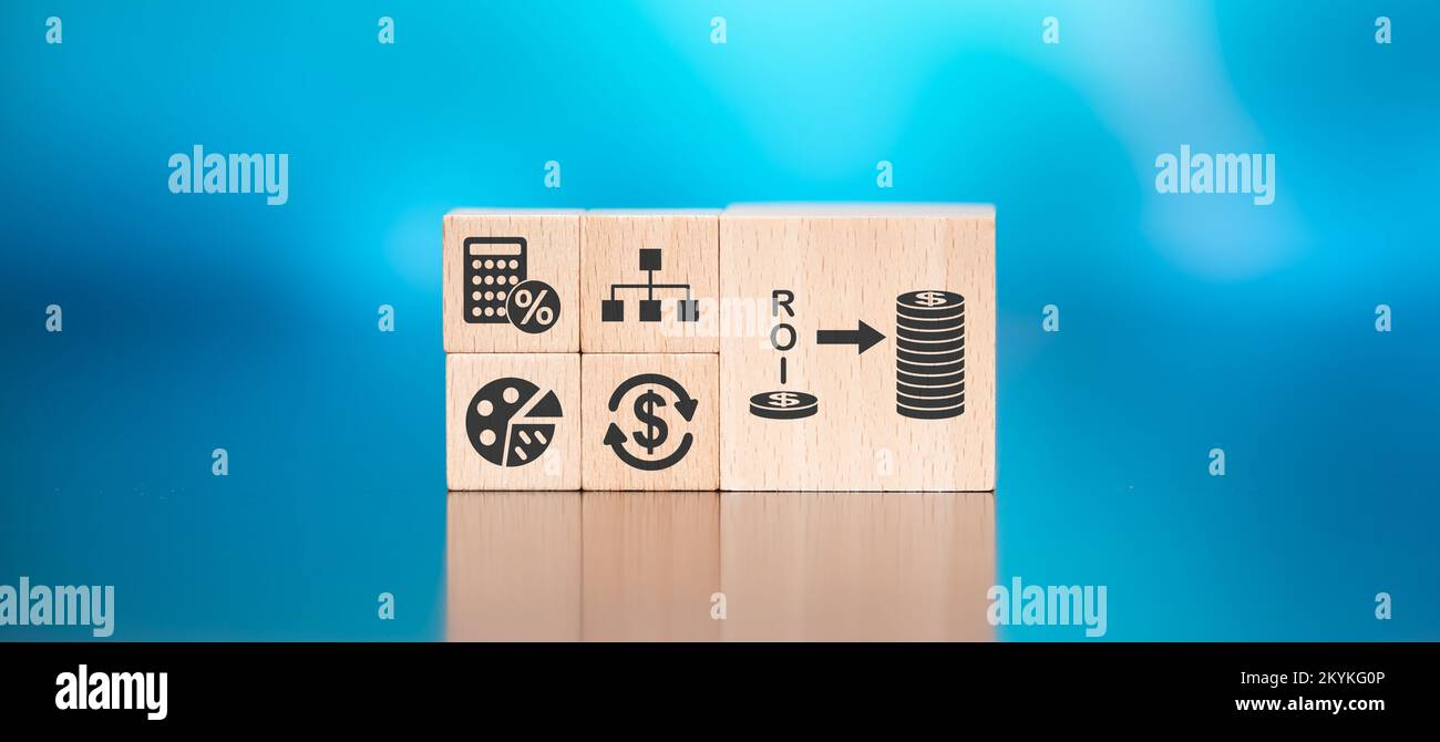 Wooden blocks with symbol of roi concept on blue background Stock Photo ...